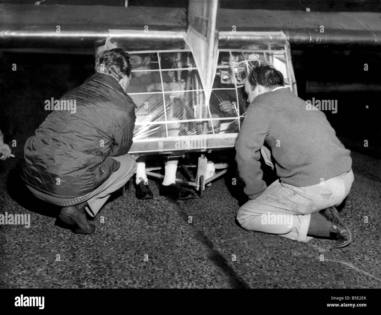 Derek Gray and Barry Stacy attempt to get a man propelled plane off the ...