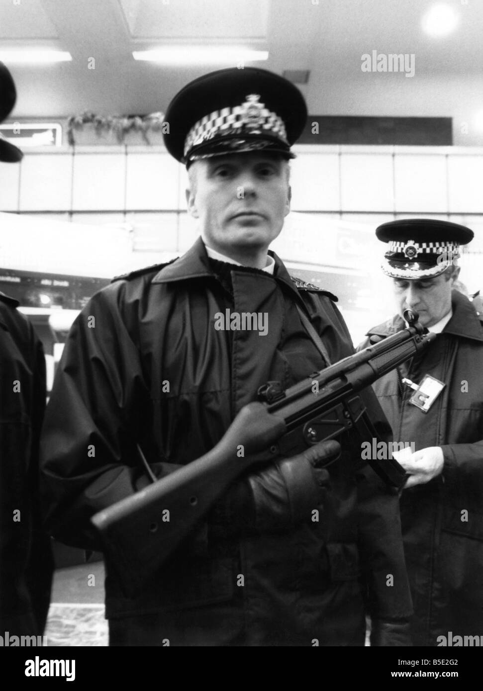 Police with machine guns at Heathrow airport. January 1986 Stock Photo ...