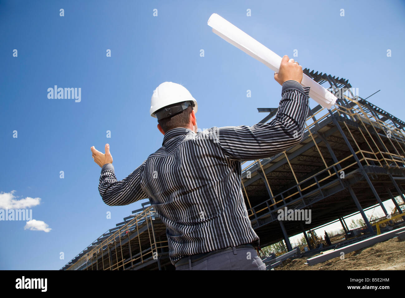 Architect overlooking building site Stock Photo - Alamy
