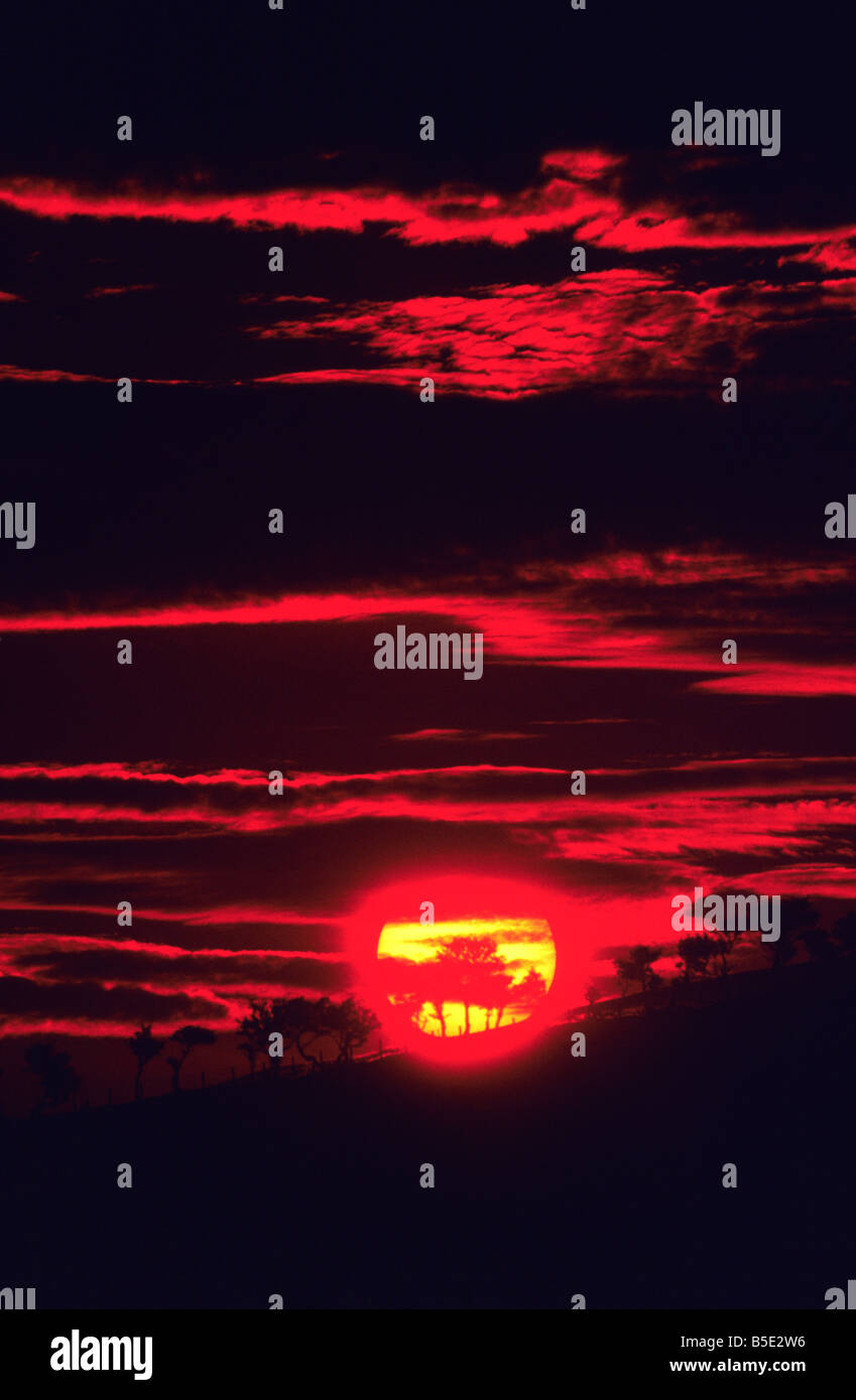 False colour sunrise (Red filter added to lens Stock Photo - Alamy