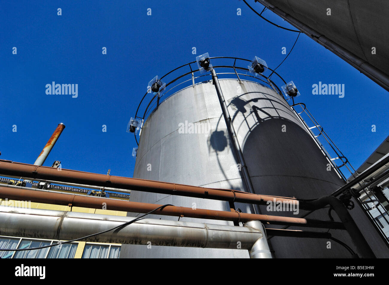 Industrial plant, silo, piping system Stock Photo - Alamy