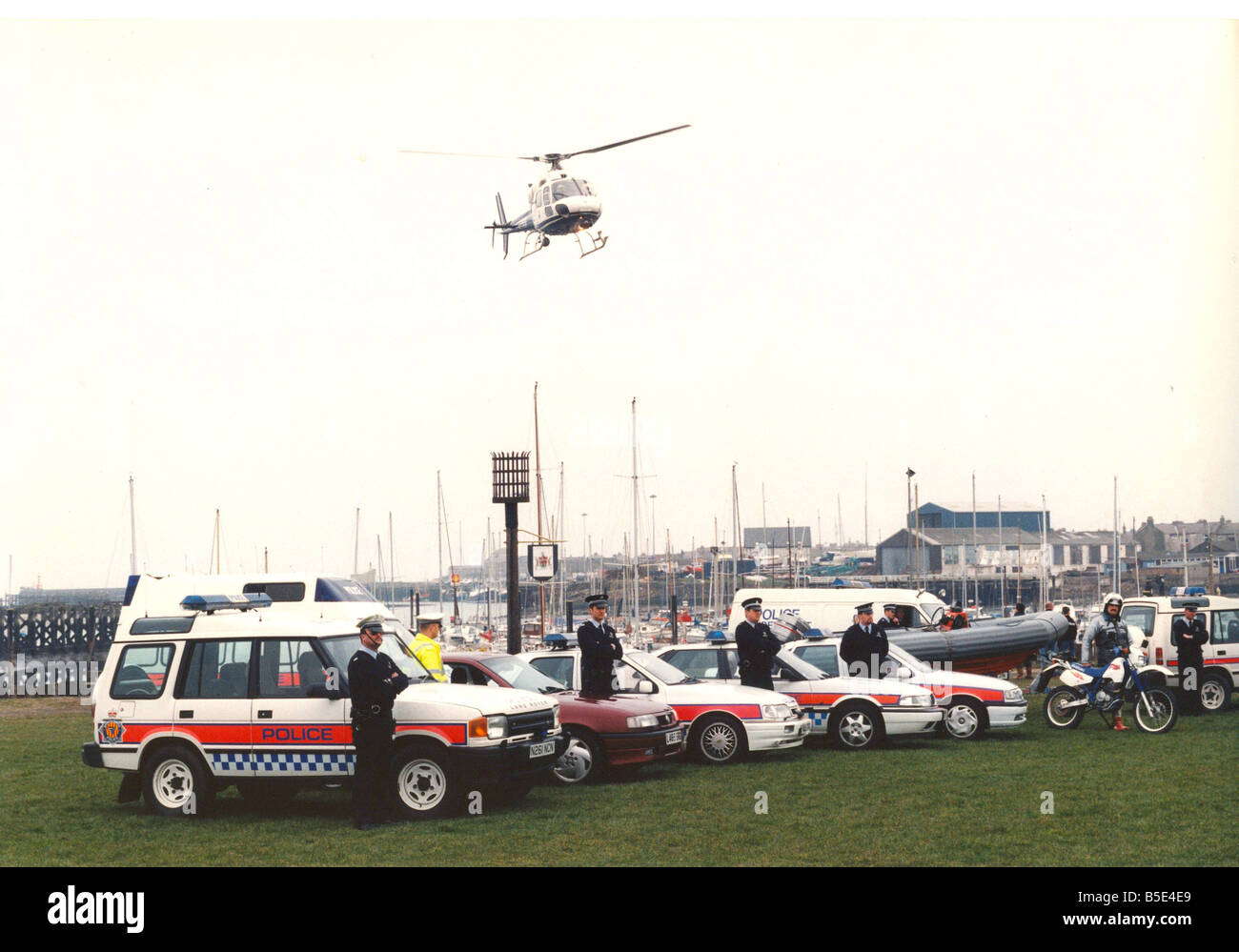 Police officers in their varied forms of transport cars motorcycles and ...