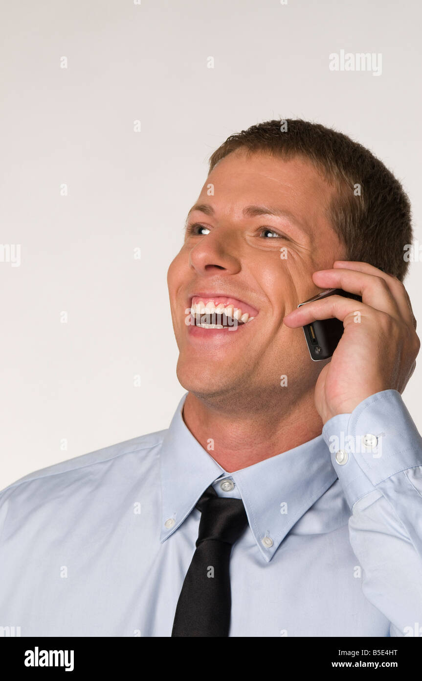 Businessman using mobile phone, smiling, portrait Stock Photo - Alamy