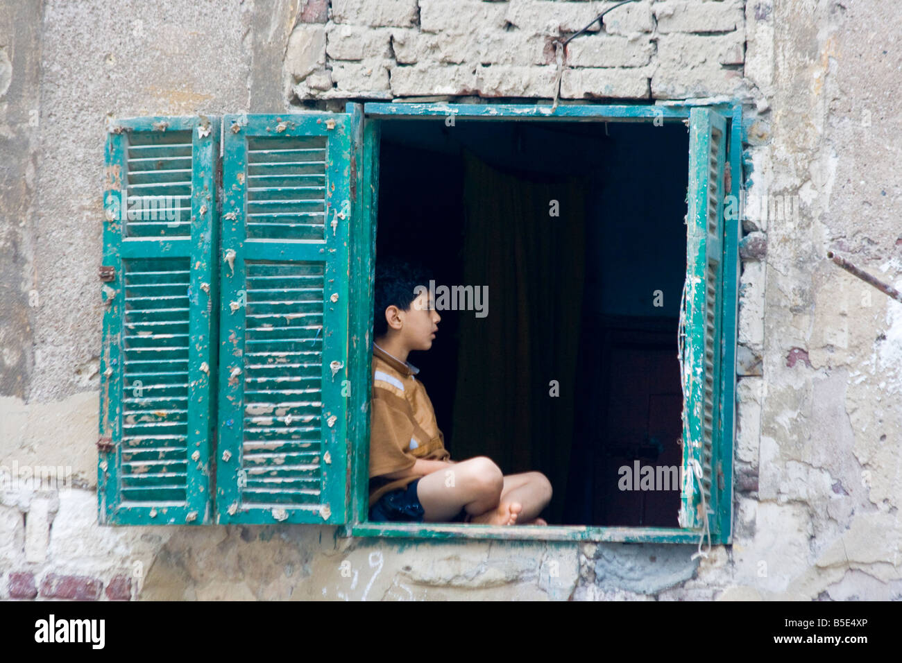 Egyptian Boy in a Window in Alexandria Egypt Stock Photo - Alamy