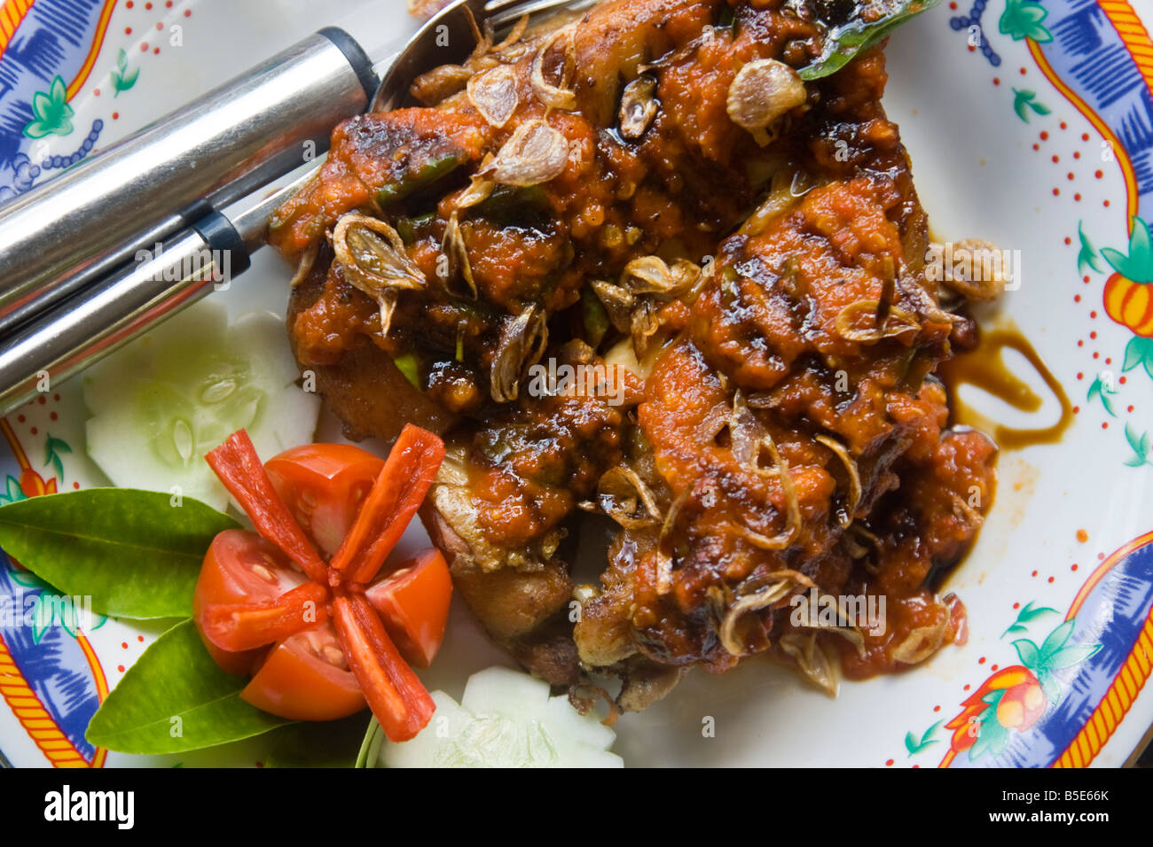 Chili Garlic Chicken in Tetebatu on Lombok in Indonesia Stock Photo - Alamy