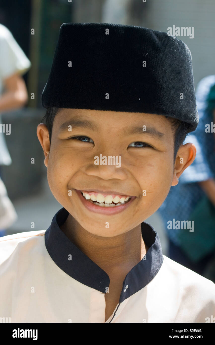 Smiling Muslim Boy in Senggigi on Lombok in Indonesia Stock Photo - Alamy
