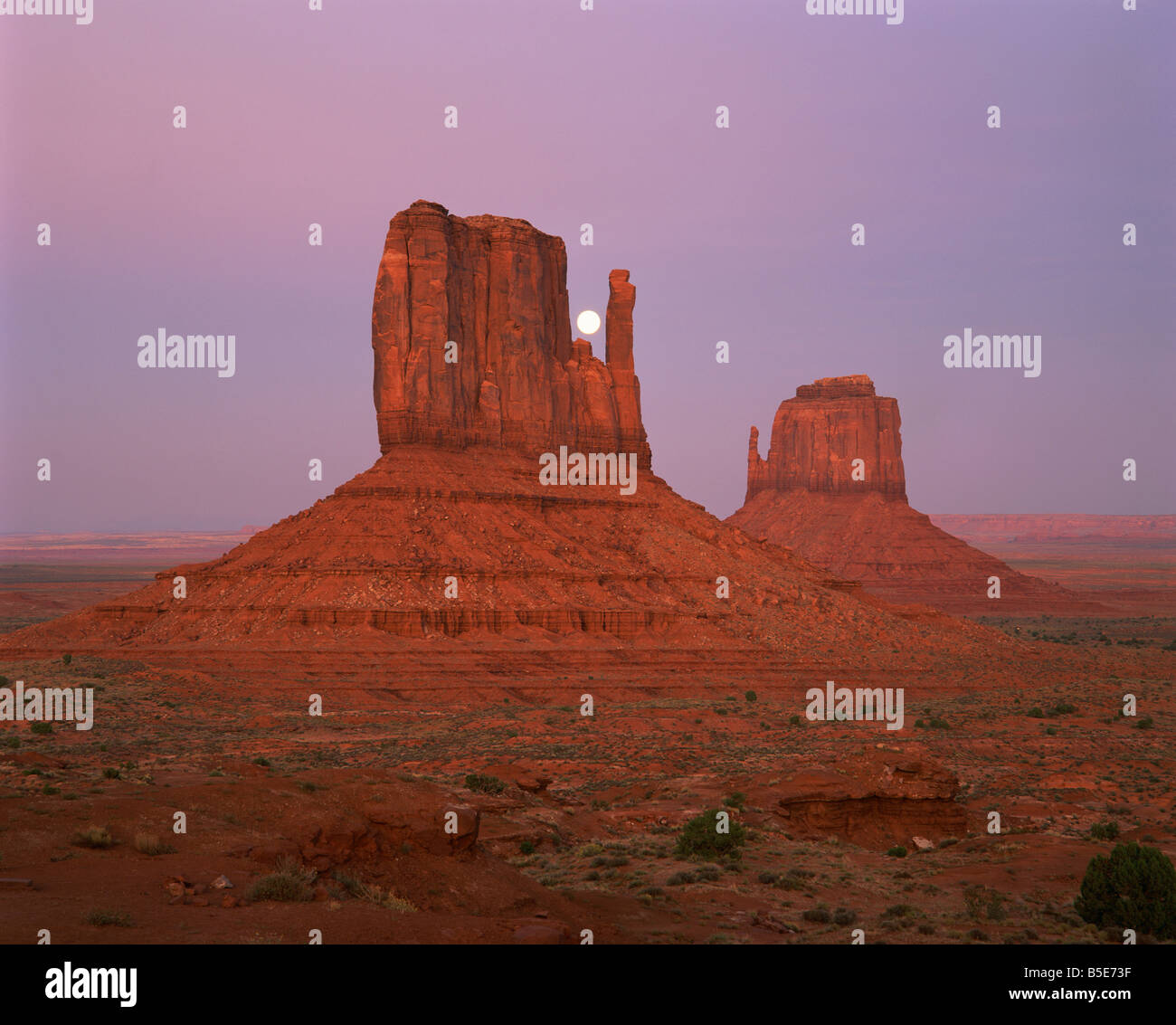 The moon above the rock formations known as The Mittens in the Navajo ...