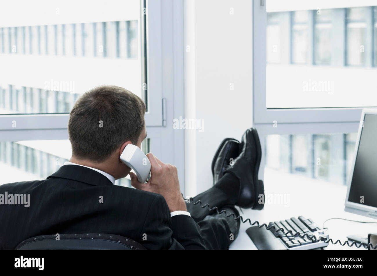 Rear back view feet businessman hi-res stock photography and images - Alamy