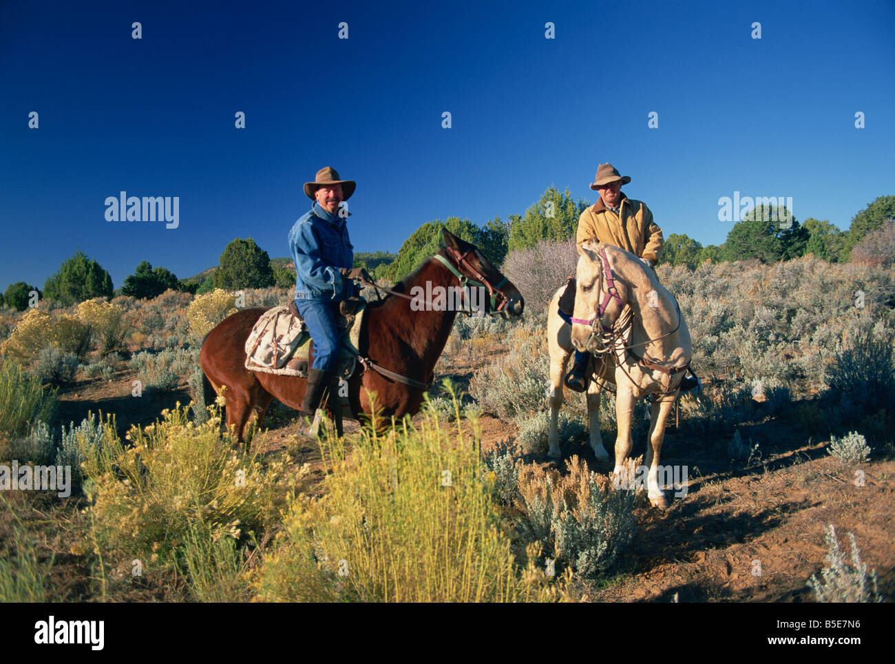 Two men on horseback hi-res stock photography and images - Alamy