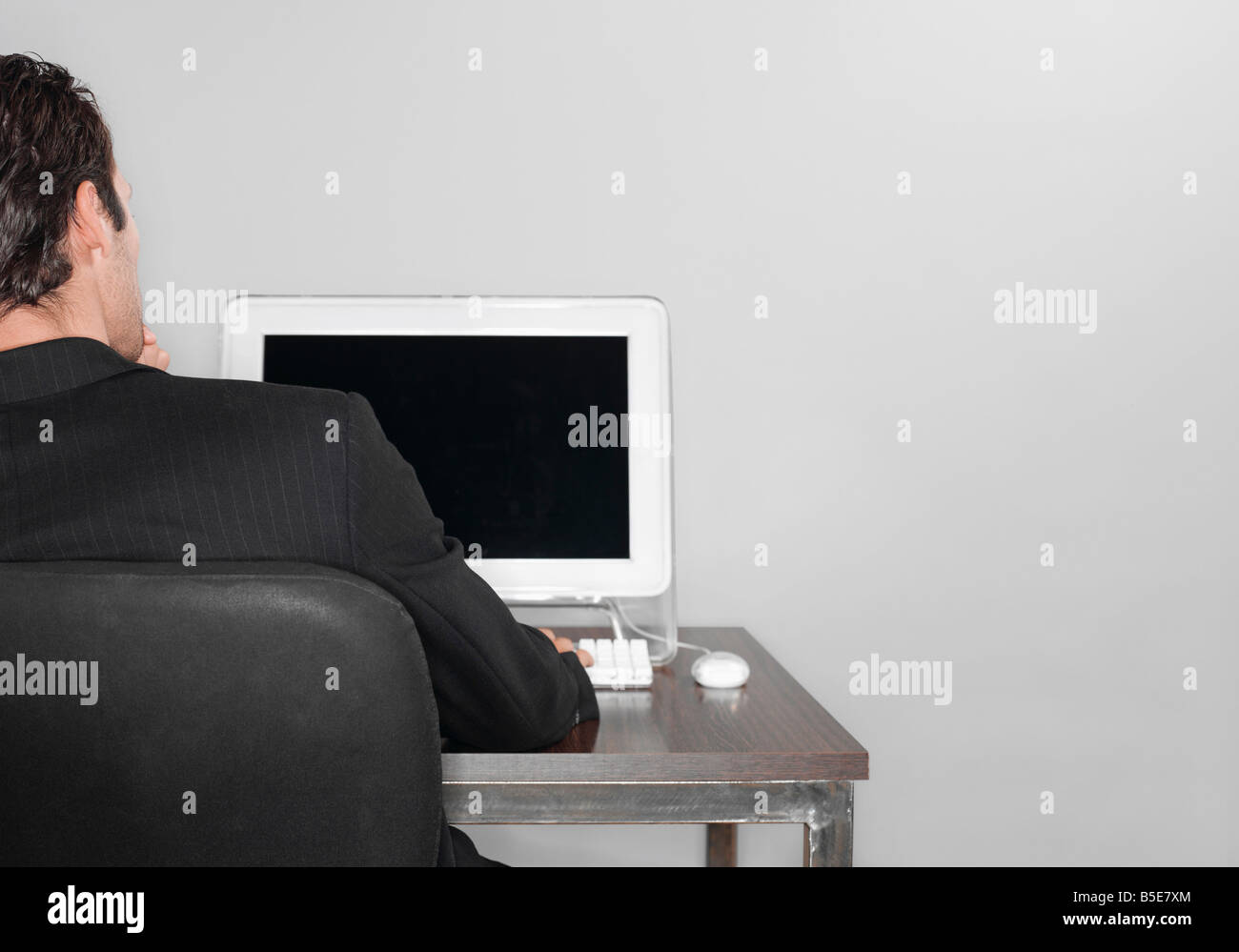 Businessman using a computer Stock Photo - Alamy