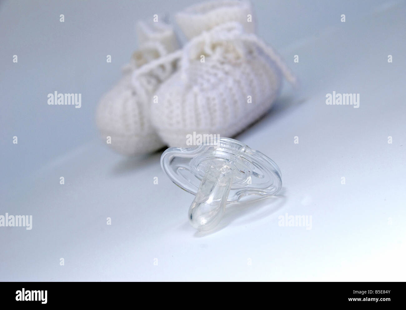 baby dummy and shoes Stock Photo - Alamy