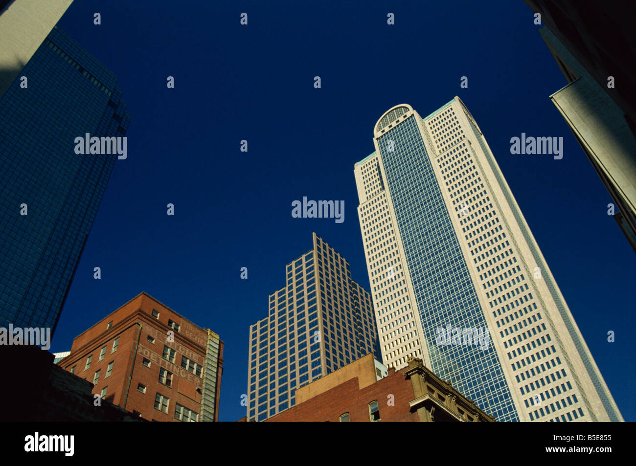 Old brick building contrasts with modern skyscrapers in Dallas Texas ...
