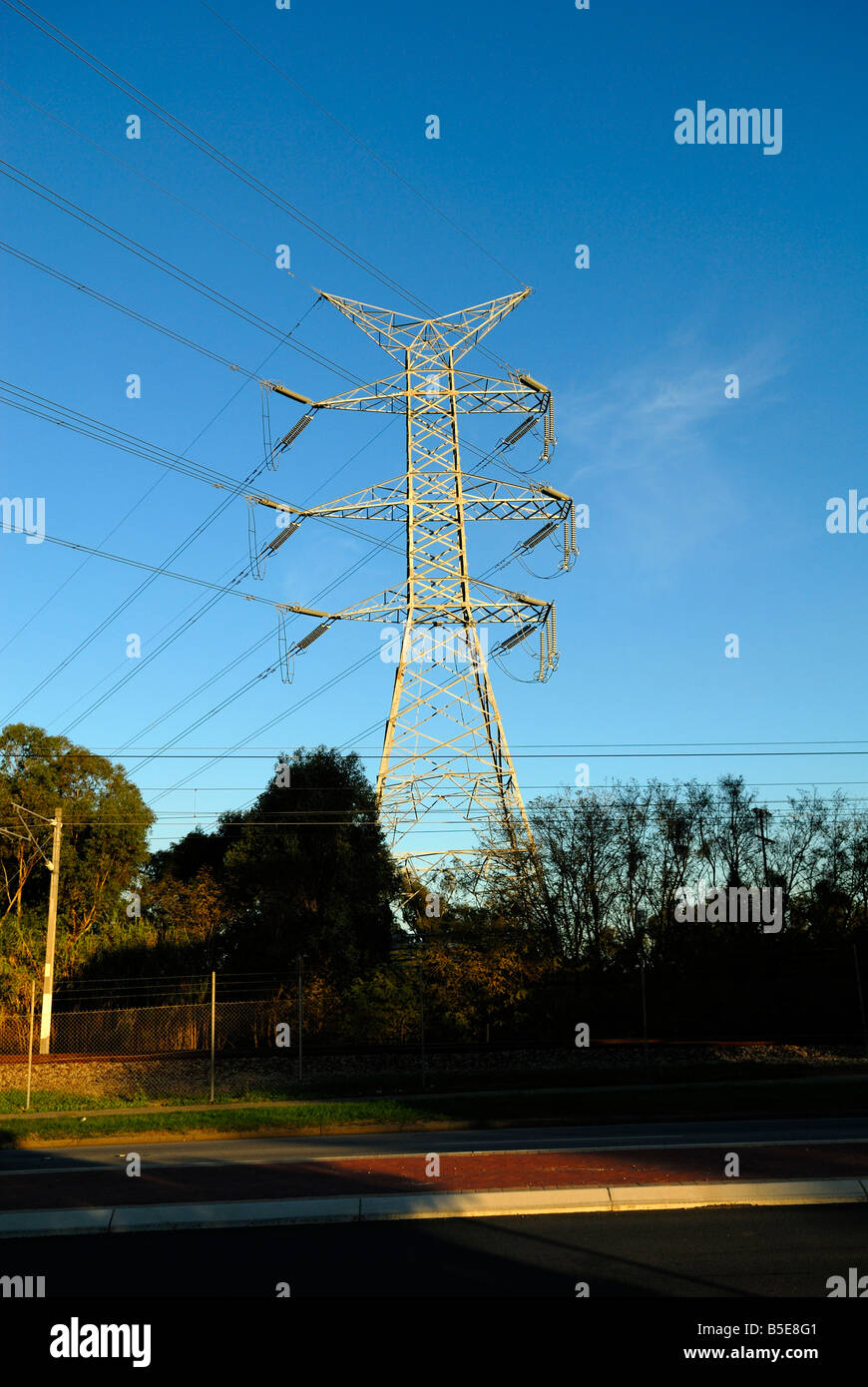 Pylon and high voltage power lines making a right-angled turn Stock ...