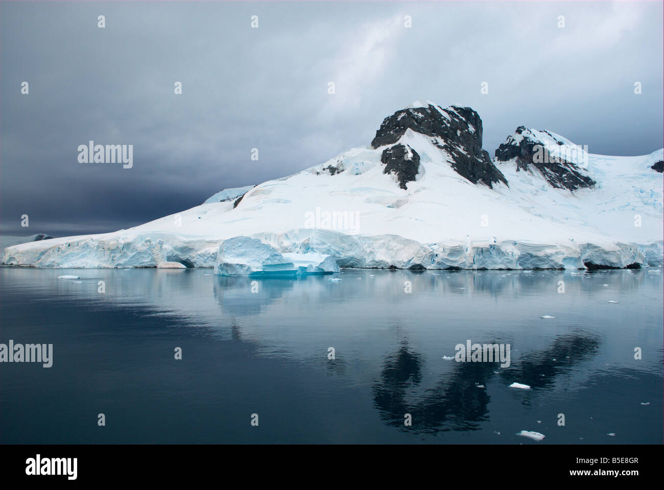 Iced rocks on water Stock Photo - Alamy