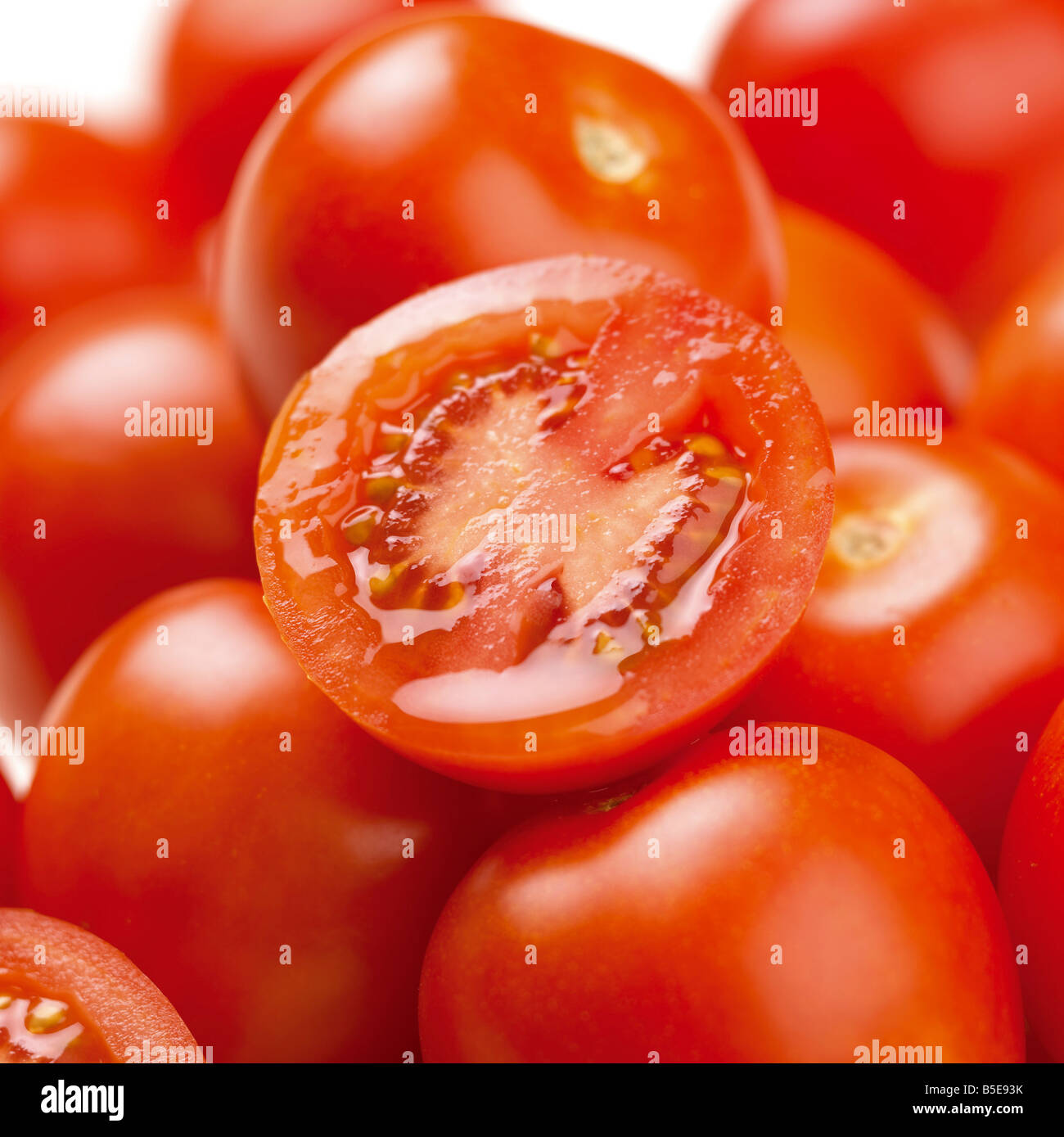 Cherry Tomatoes with one sliced Stock Photo - Alamy