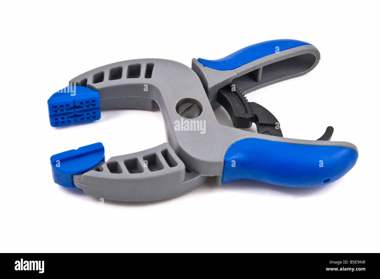 A plastic spring clamp such as used in woodworking Stock Photo - Alamy