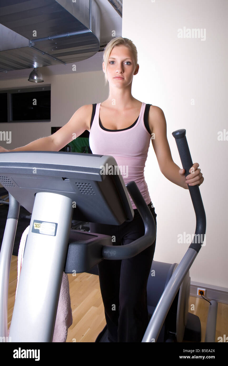 young woman training on Stairmaster Stock Photo - Alamy