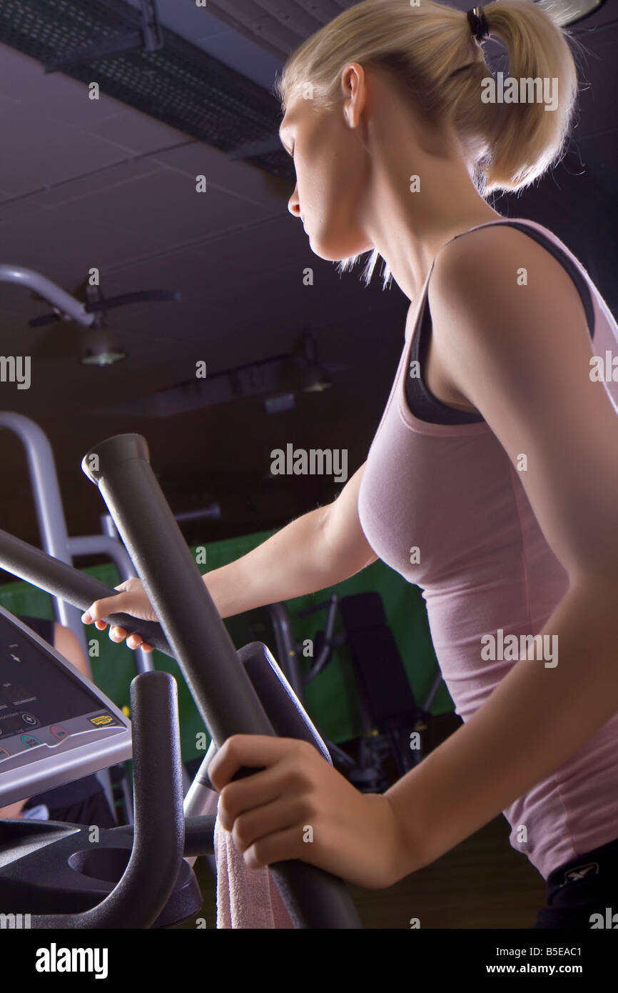 young woman training on Stairmaster Stock Photo - Alamy