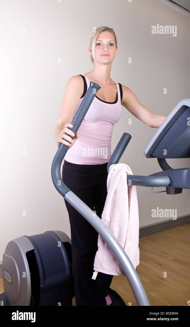 young woman training on Stairmaster Stock Photo - Alamy