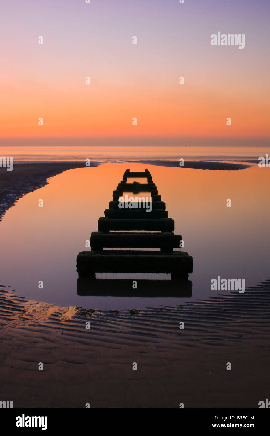 Groynes on blackpool beach after sunset Stock Photo - Alamy