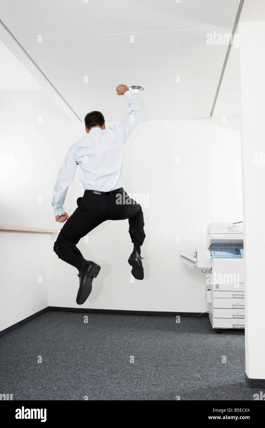 Person jumping in air office attire hi-res stock photography and images ...