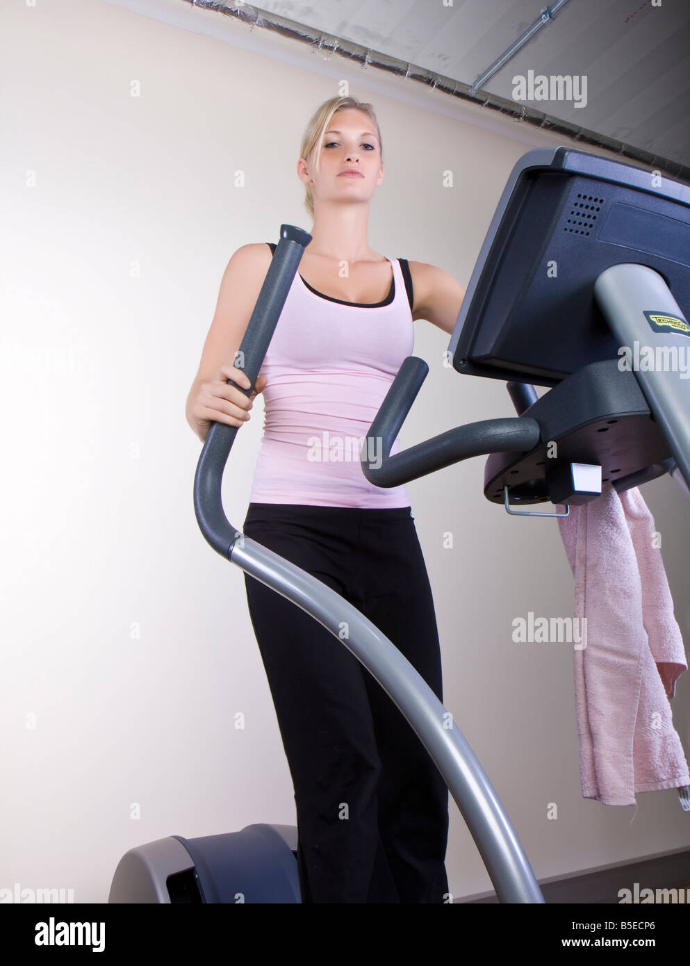 young woman training on Stairmaster Stock Photo - Alamy