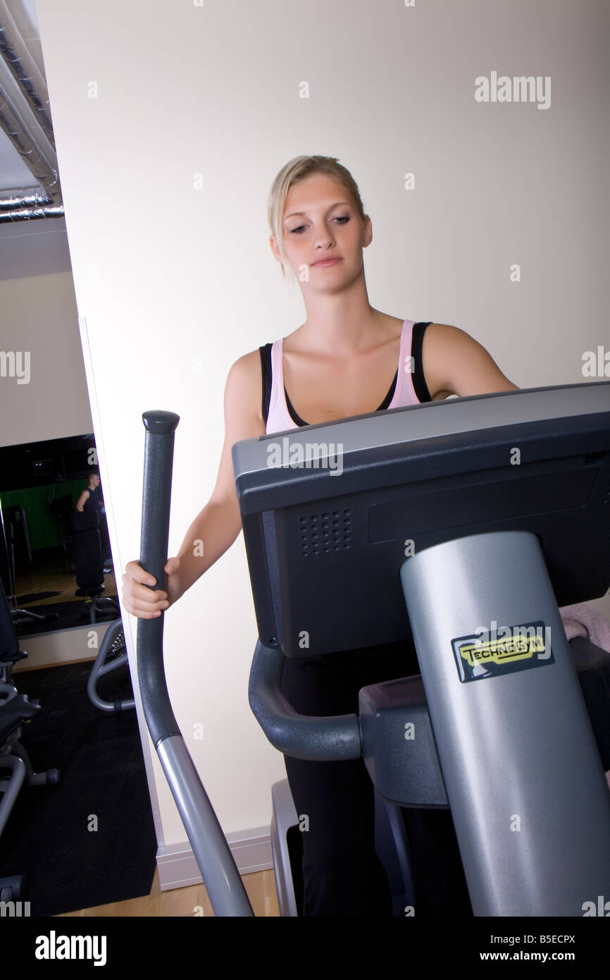young woman training on Stairmaster Stock Photo - Alamy
