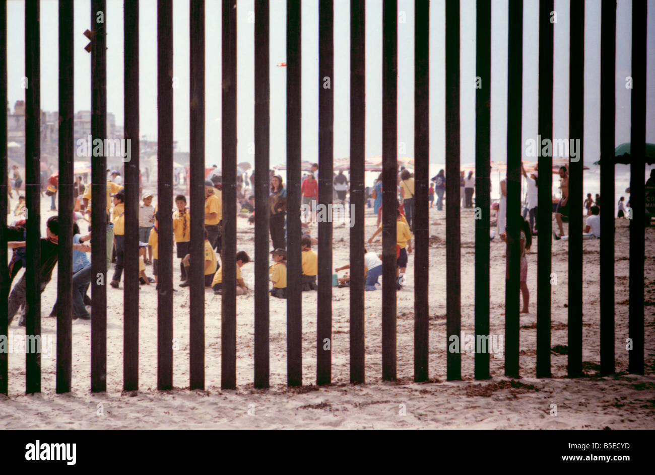 The fence and people in Mexico at the International Border at Border ...
