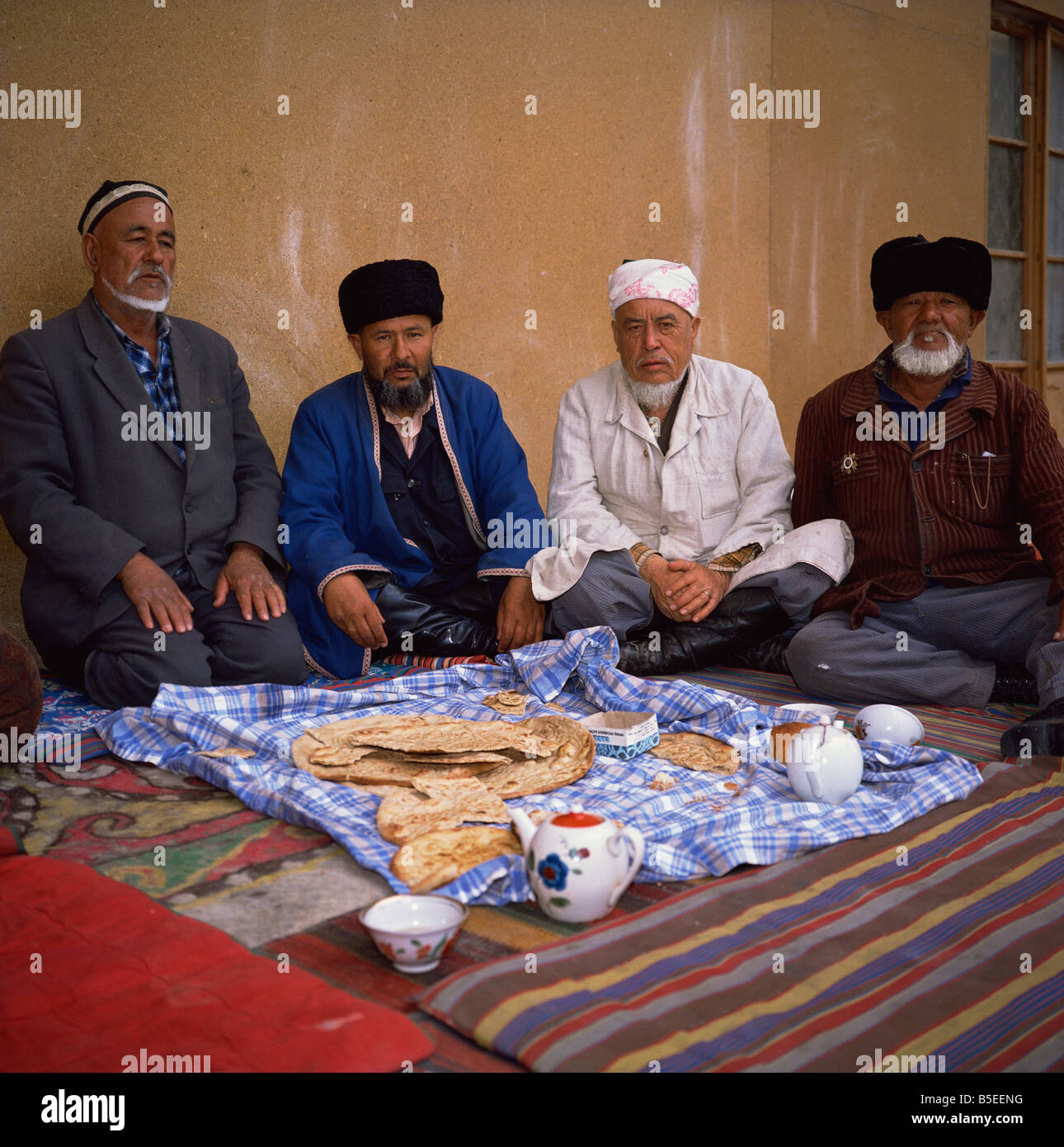 Uzbek imam and Muslims in a mosque, Khiva, Uzbekistan, Central Asia ...