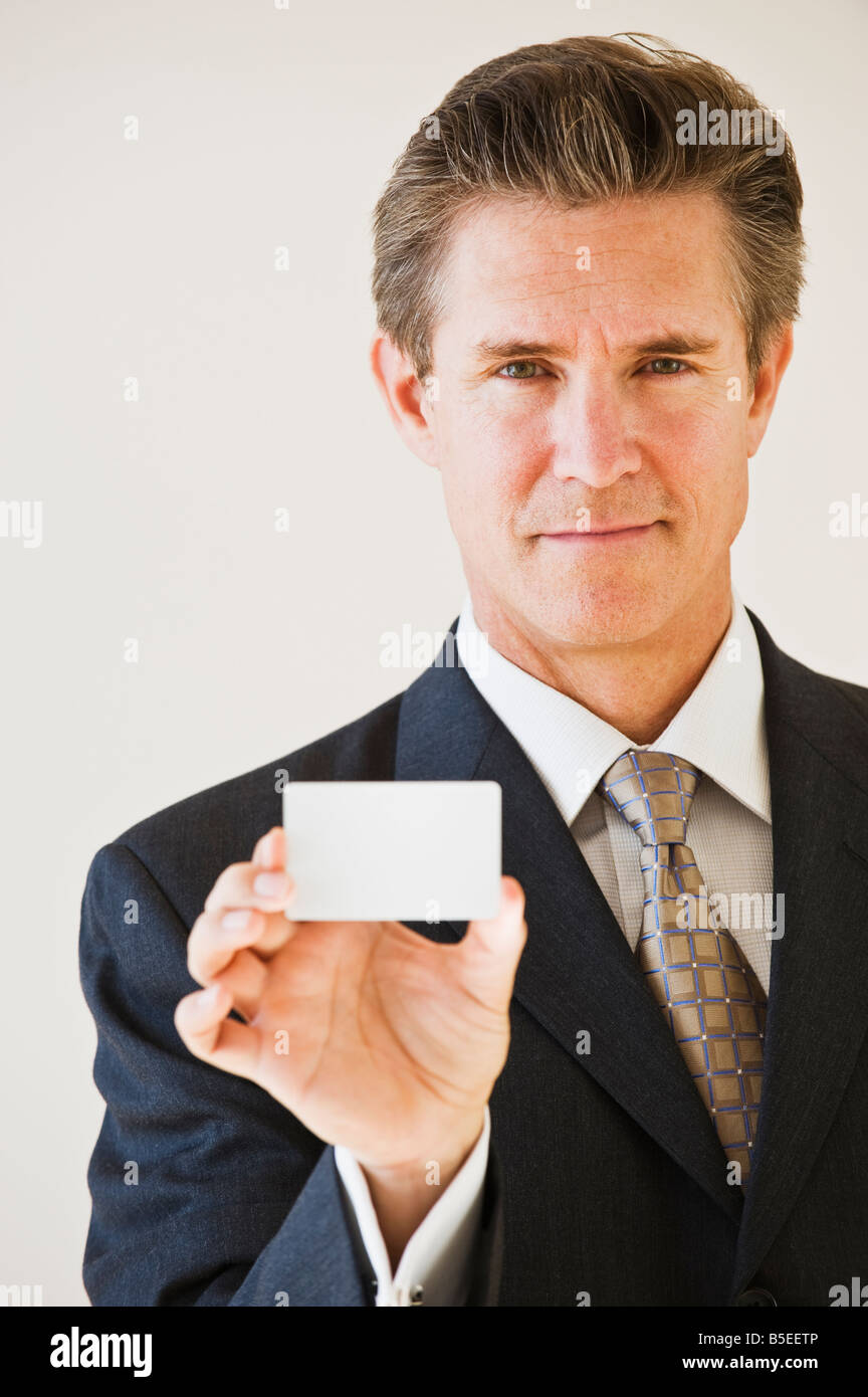 Businessman with business card Stock Photo - Alamy