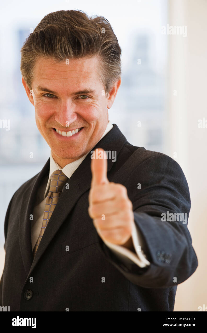 businessman with thumbs up Stock Photo - Alamy