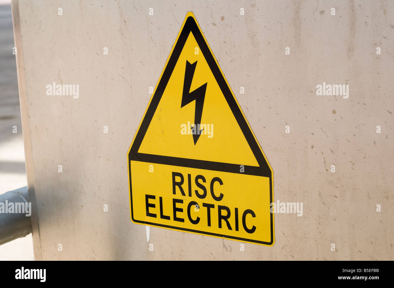 Electric risk sign Stock Photo - Alamy
