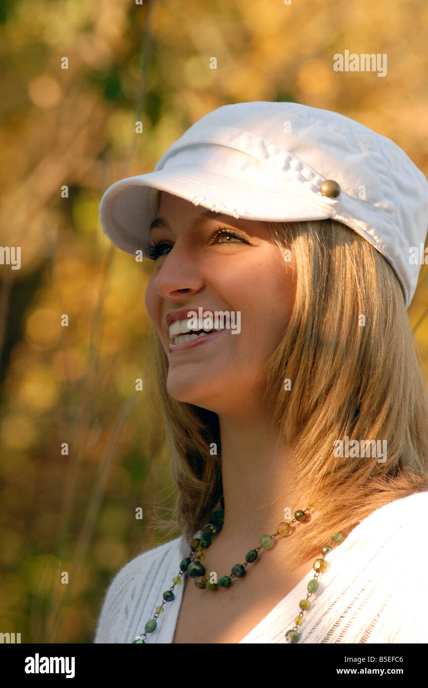 An American teenage girl wearing a cap and smiling Stock Photo - Alamy