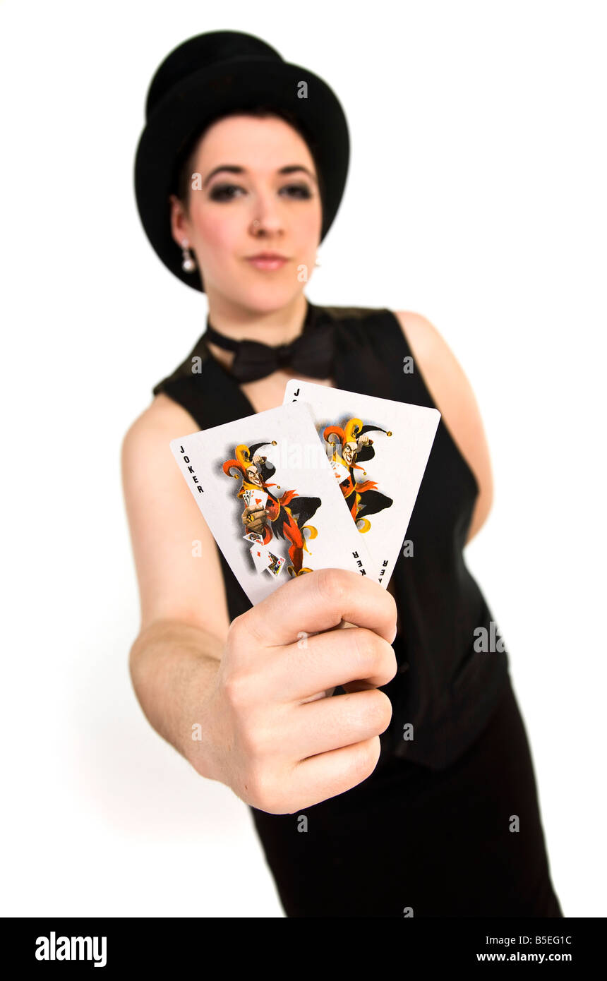 Sexy woman wearing a top hat and holding four aces Stock Photo - Alamy