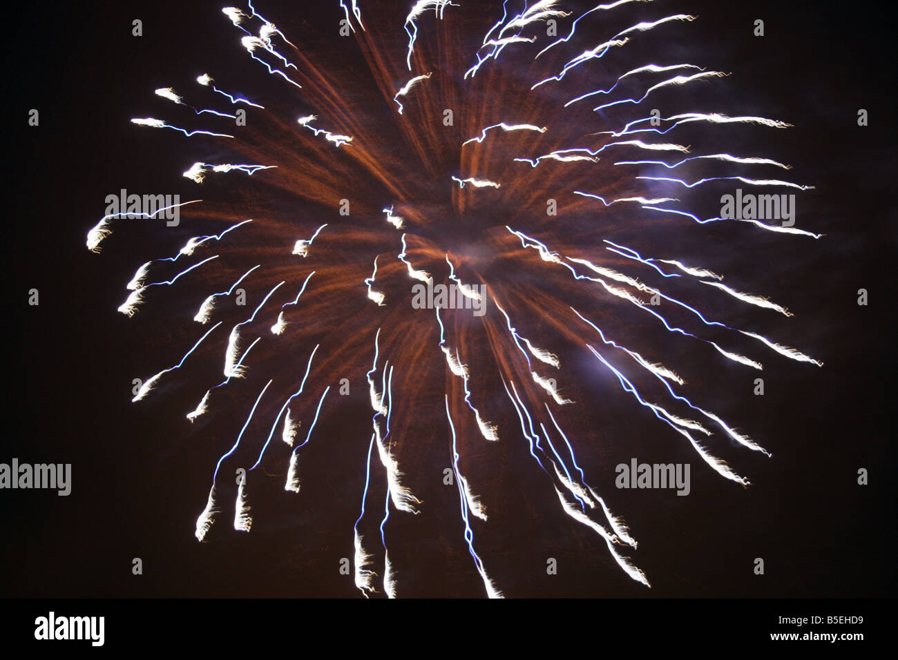 Pretty blue/lilac firework spark shower following initial explosion ...
