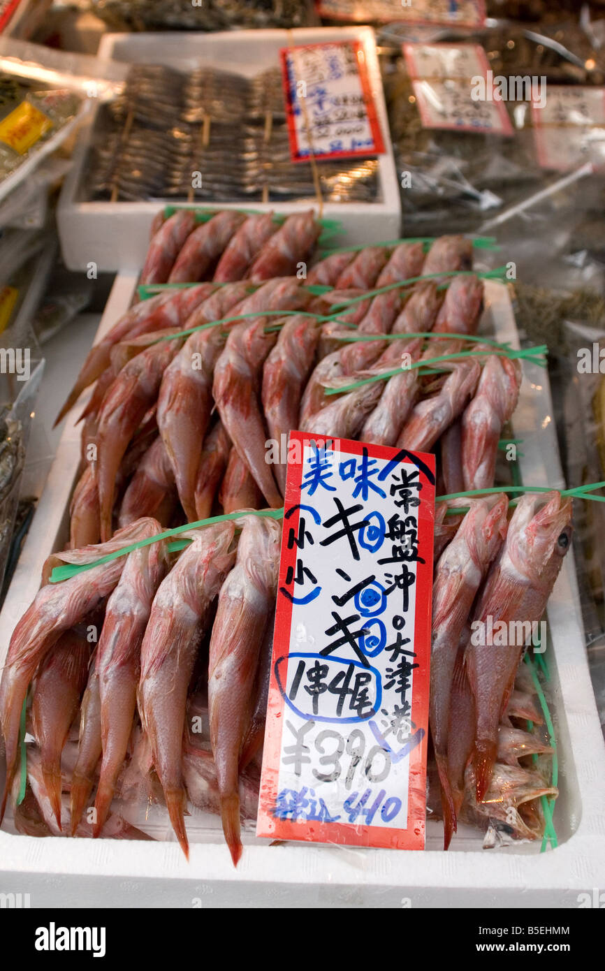 Fish is sold at a street market in the Tsukiji District of Tokyo, Japan ...