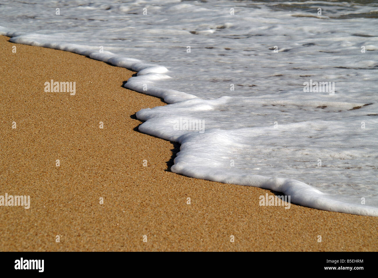 Wave on the beach Stock Photo - Alamy