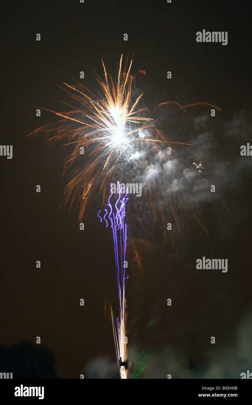 Photo recording the blue/lilac trail and bright white explosion of a ...