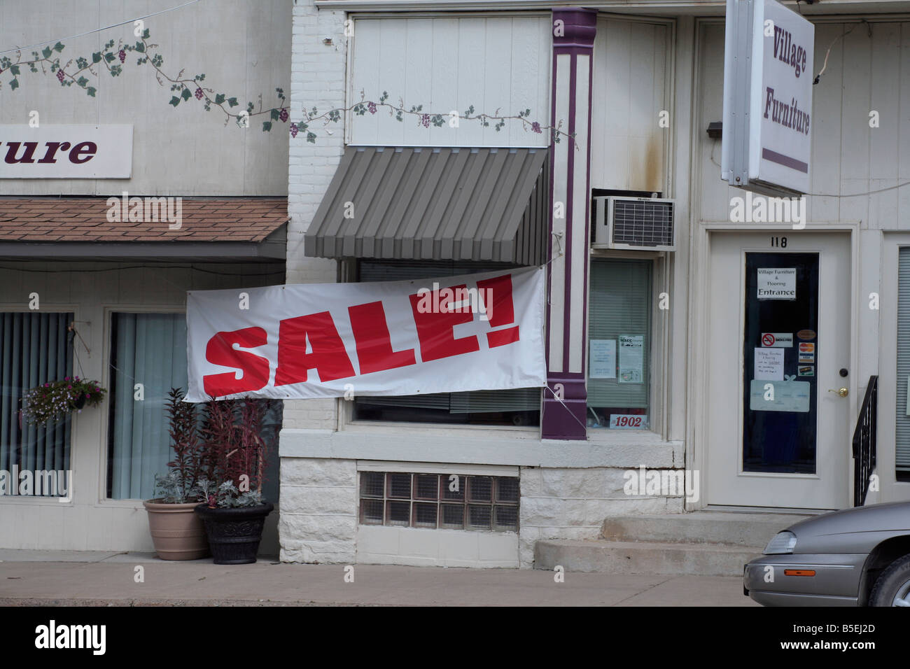 Shop with a sale sign Stock Photo - Alamy