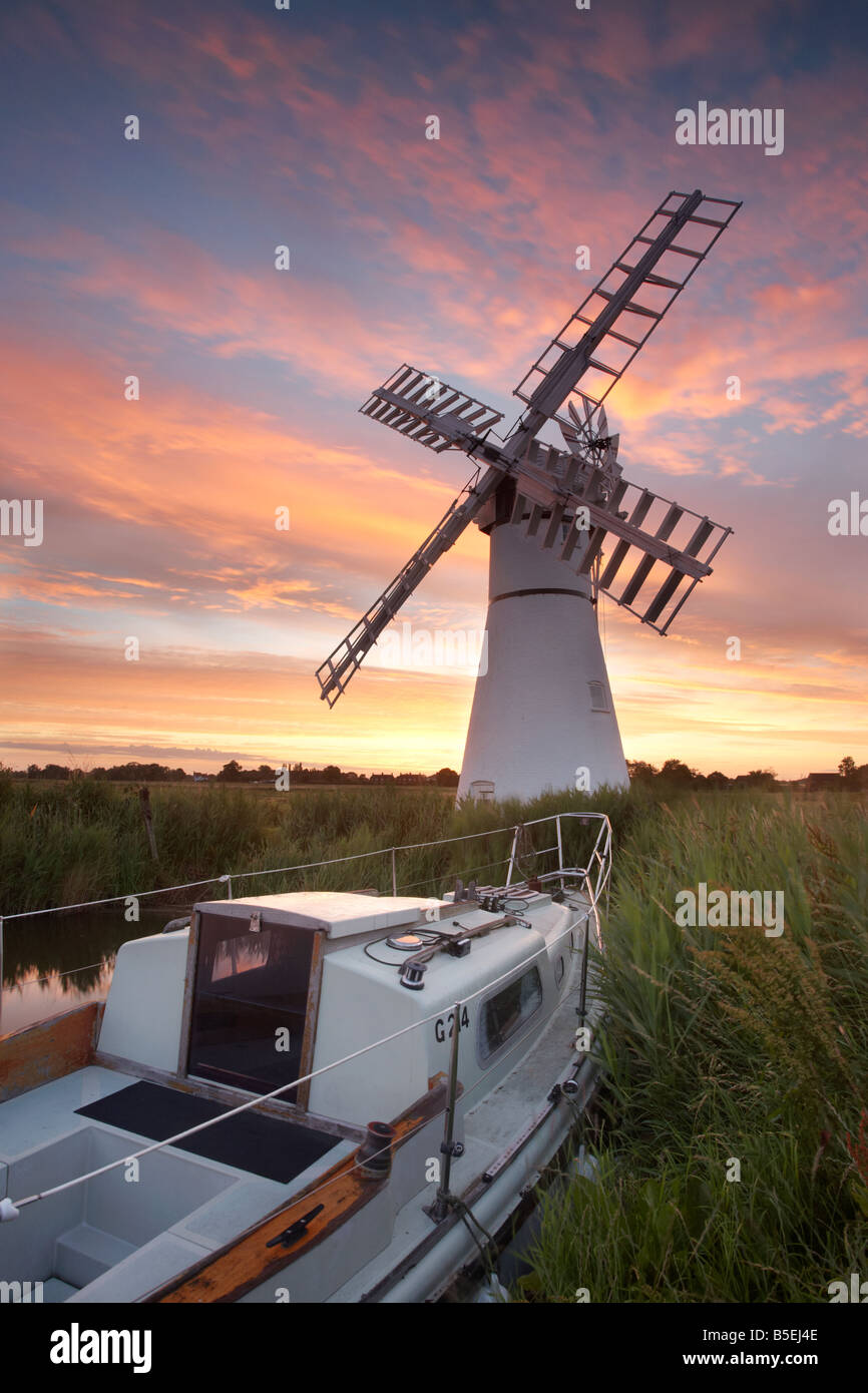 A spectacular summer sunrise behind Thurne Windmill on the Norfolk ...