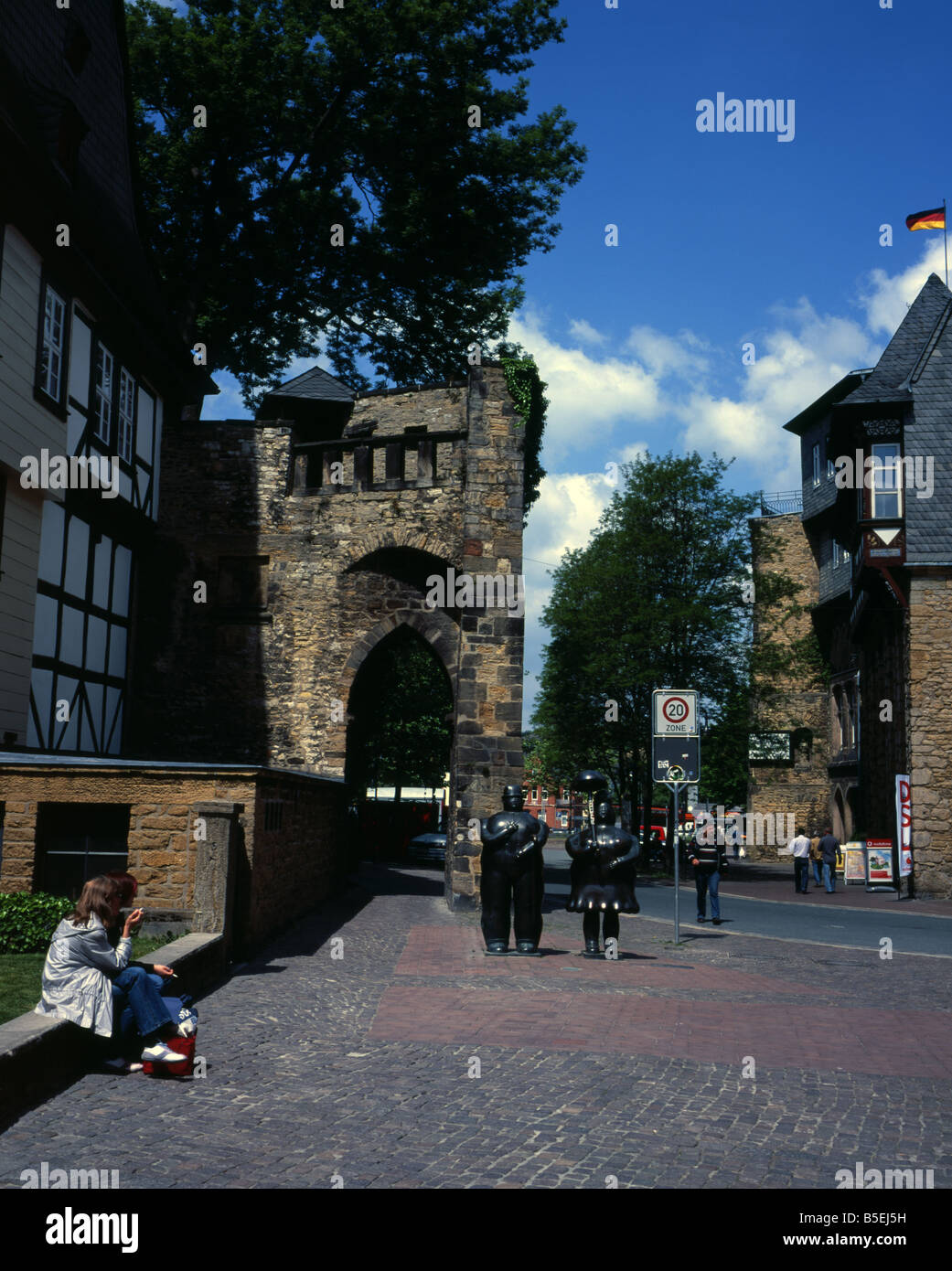 Male and Female figure sculpture and medieval gate, Goslar, Sachsen ...