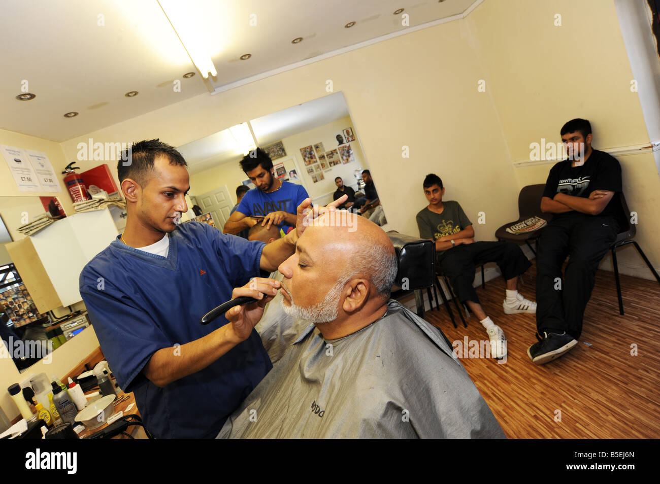 Barbers shaving man hi-res stock photography and images - Alamy