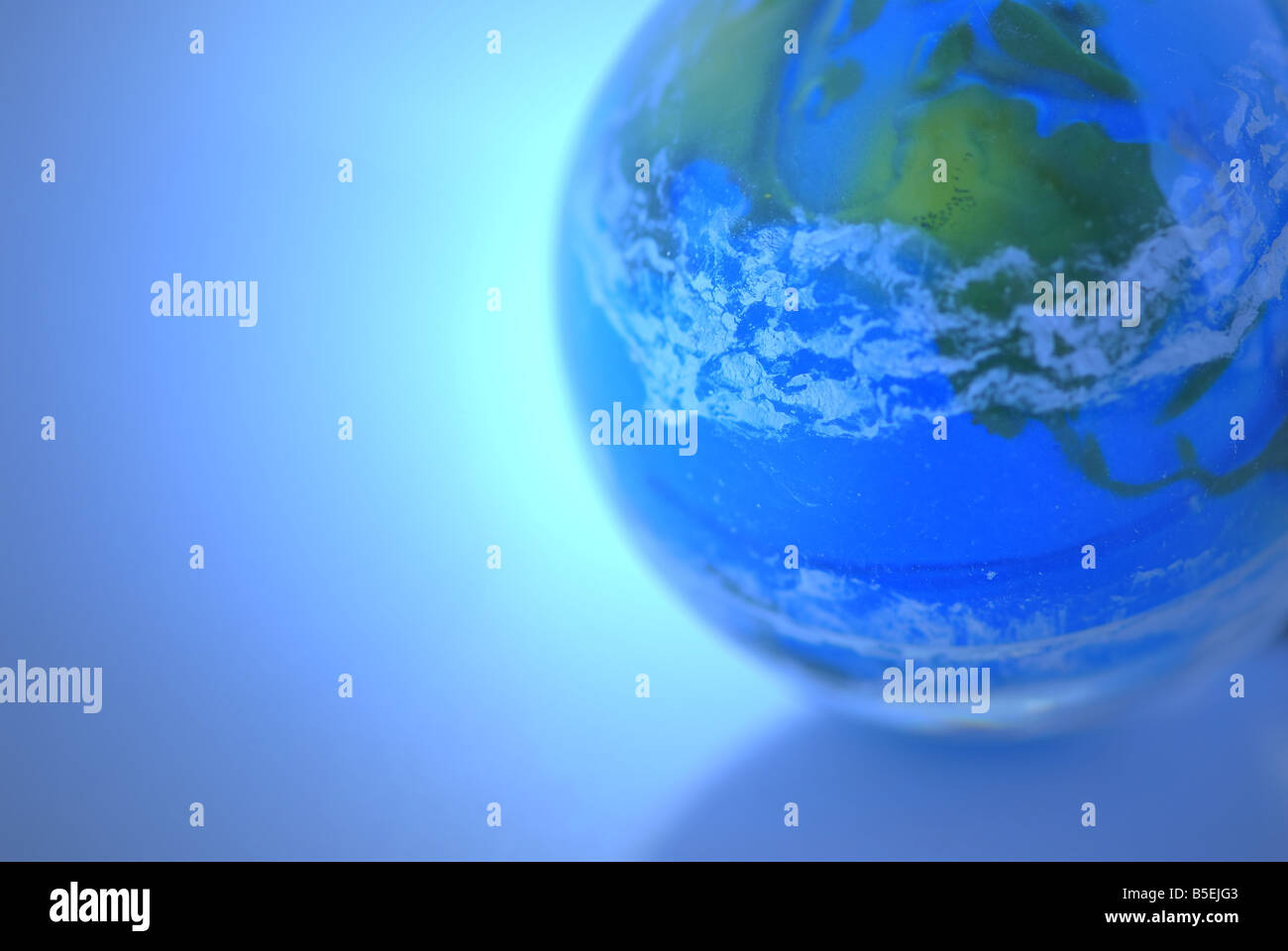 Globe on blue background as globalization concept Stock Photo - Alamy
