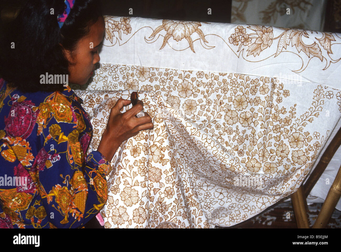 Woman working the batik technique on a textile in Indonesia Stock Photo ...