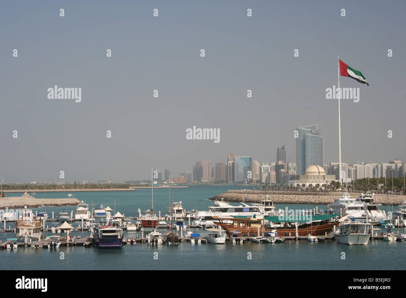 Abu Dhabi Corniche UAE Flag marina boats skyline Stock Photo - Alamy