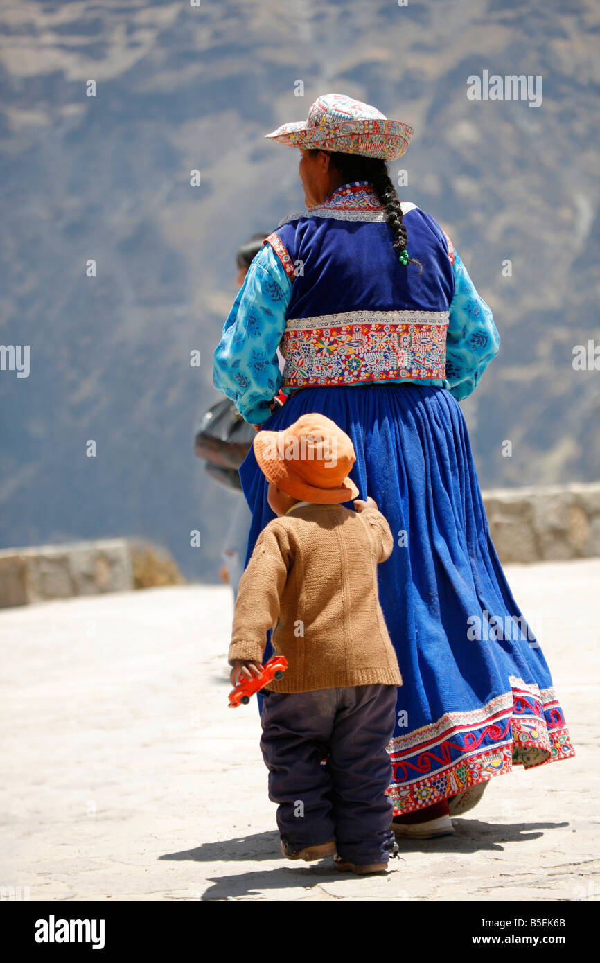 Woman and child in traditional costume ar Cruz del Condor Stock Photo ...