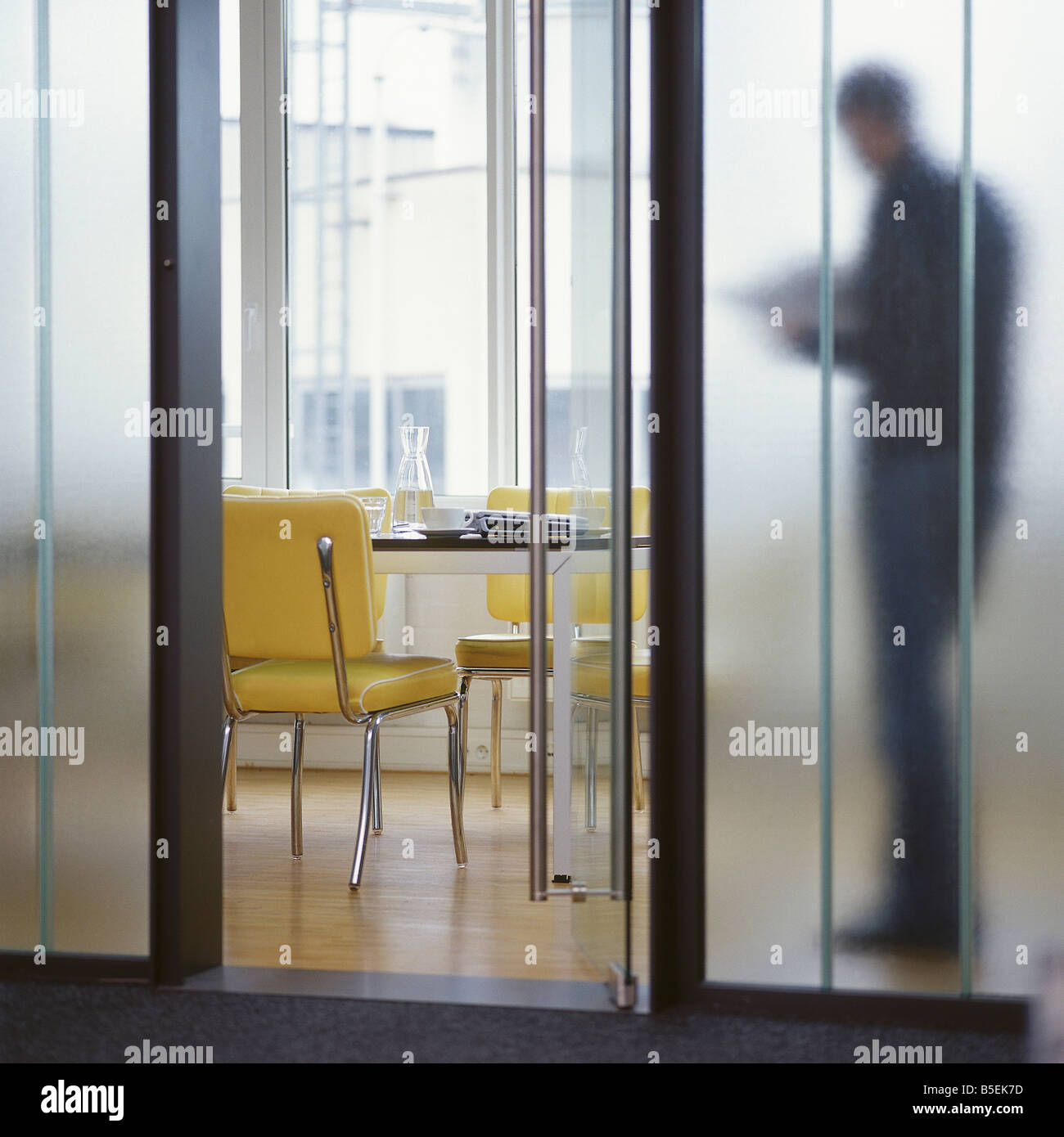 Person standing in a meeting room Stock Photo - Alamy