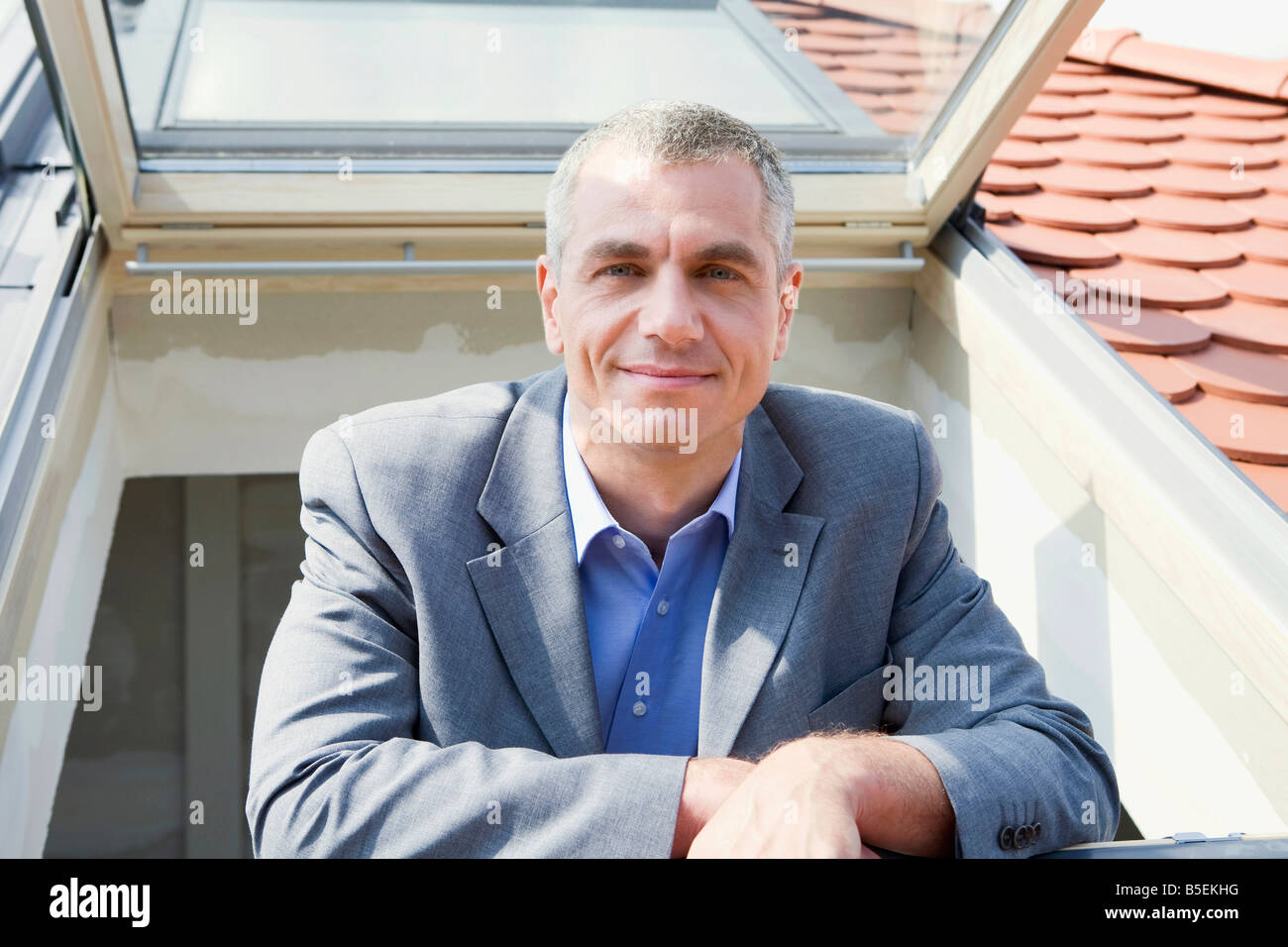 Man looking out window, portrait Stock Photo - Alamy