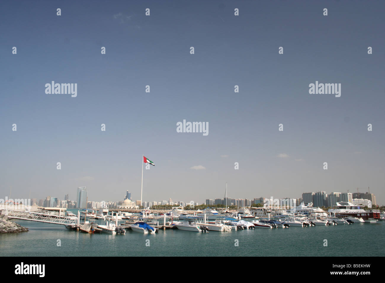 Abu Dhabi Corniche UAE Flag marina boats skyline Stock Photo - Alamy