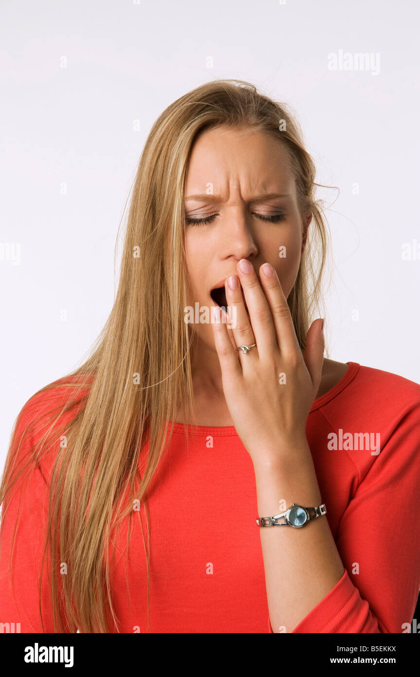 Young woman yawning, portrait Stock Photo - Alamy